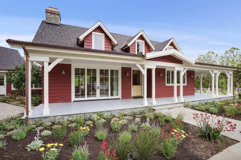 Step into this beyond stunning red farmhouse home in Northern California
