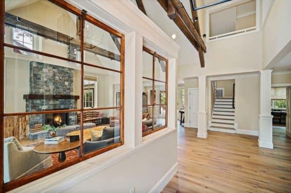Step into this beyond stunning red farmhouse home in Northern California