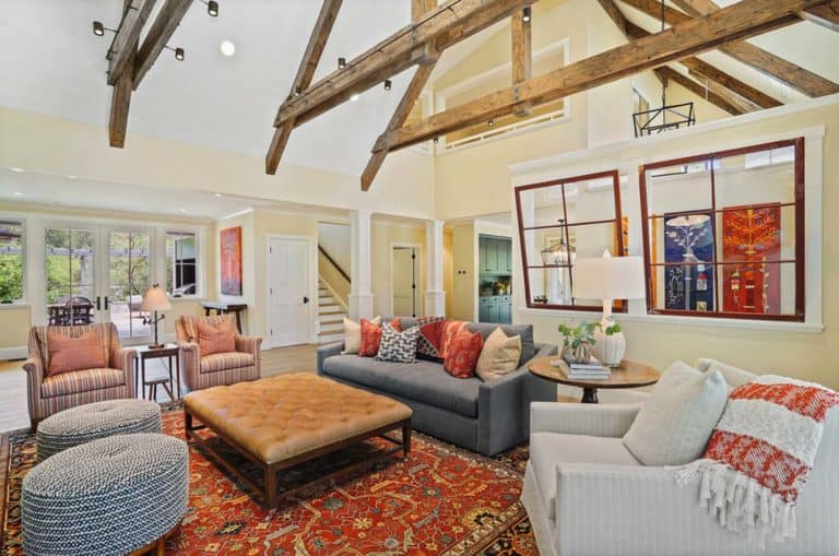 Step into this beyond stunning red farmhouse home in Northern California