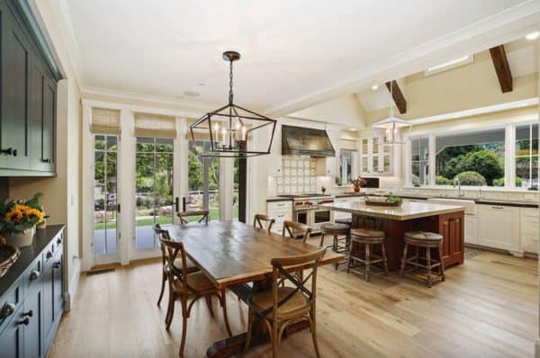 Step into this beyond stunning red farmhouse home in Northern California