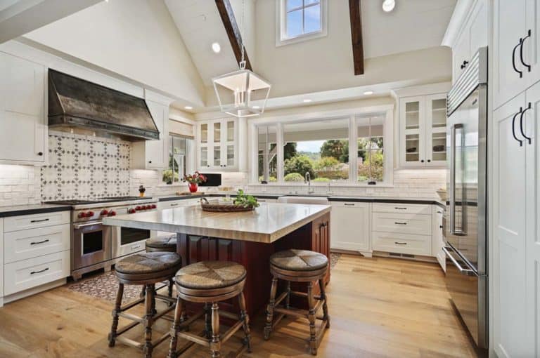 Step into this beyond stunning red farmhouse home in Northern California