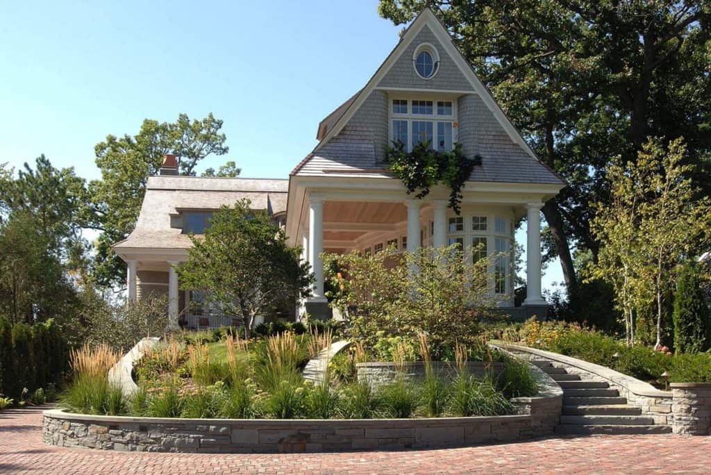 Charming shingle-style cottage sits on a knoll above Lake Minnetonka