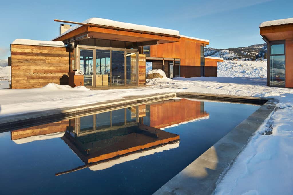 Rustic steel and reclaimed wood escape with stunning Cascade Mountain views