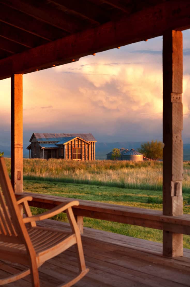 Rustic ranch retreat in Montana features a dramatic mountain backdrop