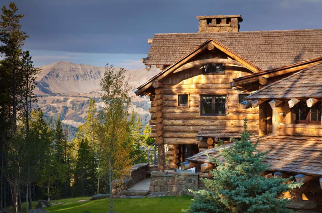 Step into this dreamy Big Sky mountain cabin with rustic luxe interiors