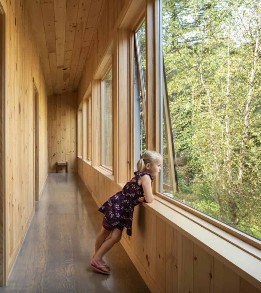 Cabin retreat designed with a rustic camp feel in coastal Maine