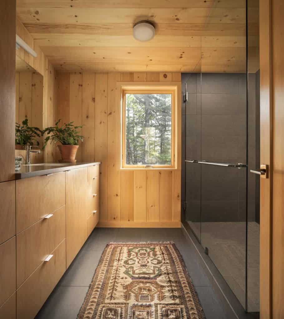 Cabin retreat designed with a rustic camp feel in coastal Maine