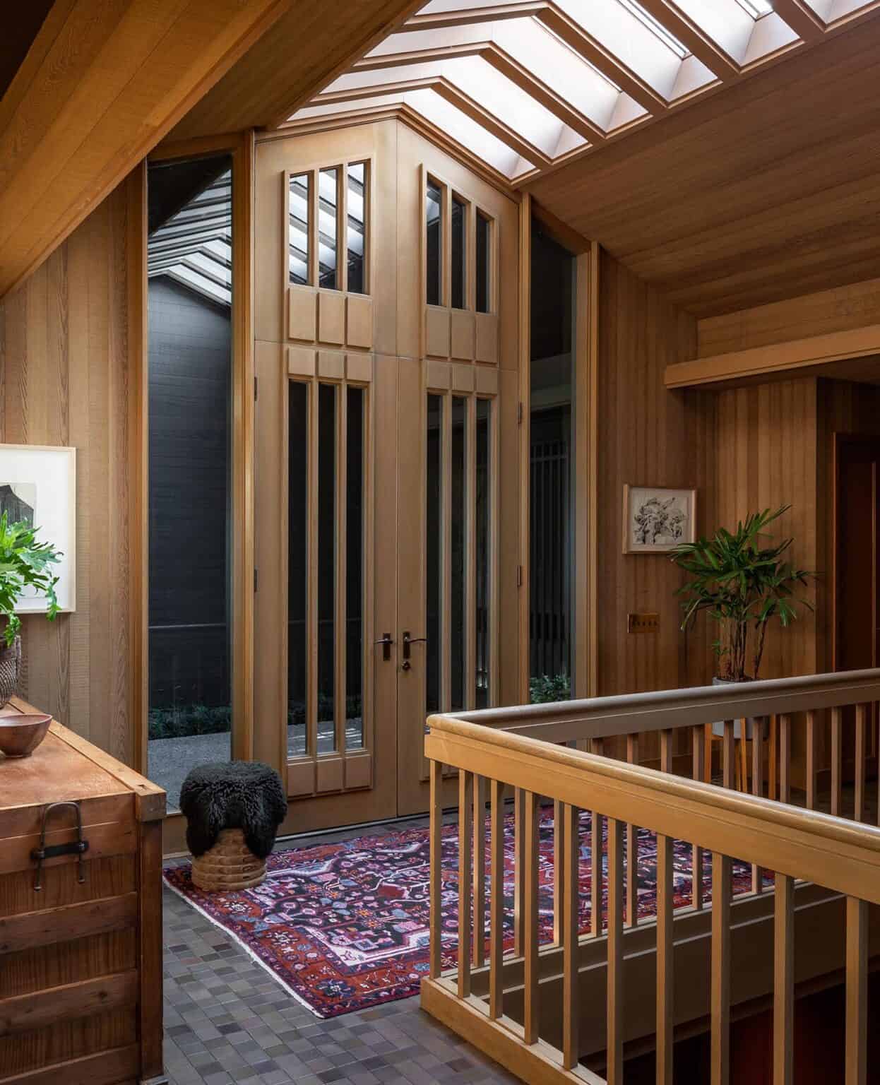 Treehouse inspired midcentury home perched on a cliffside above Puget Sound