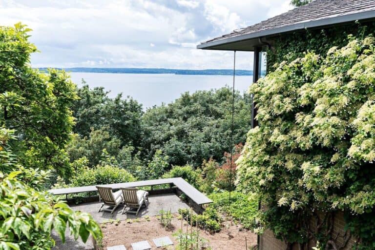 Treehouse inspired midcentury home perched on a cliffside above Puget Sound