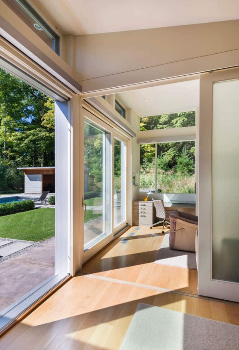 This luminous modern home offers peaceful forest setting in Massachusetts