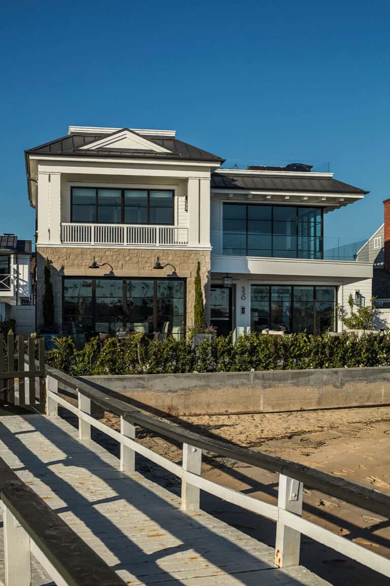 Step inside a luxurious bayfront home with coastal charm in Newport Beach