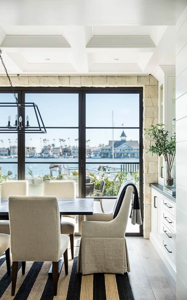 Step inside a luxurious bayfront home with coastal charm in Newport Beach