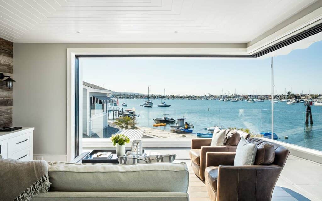 Step inside a luxurious bayfront home with coastal charm in Newport Beach