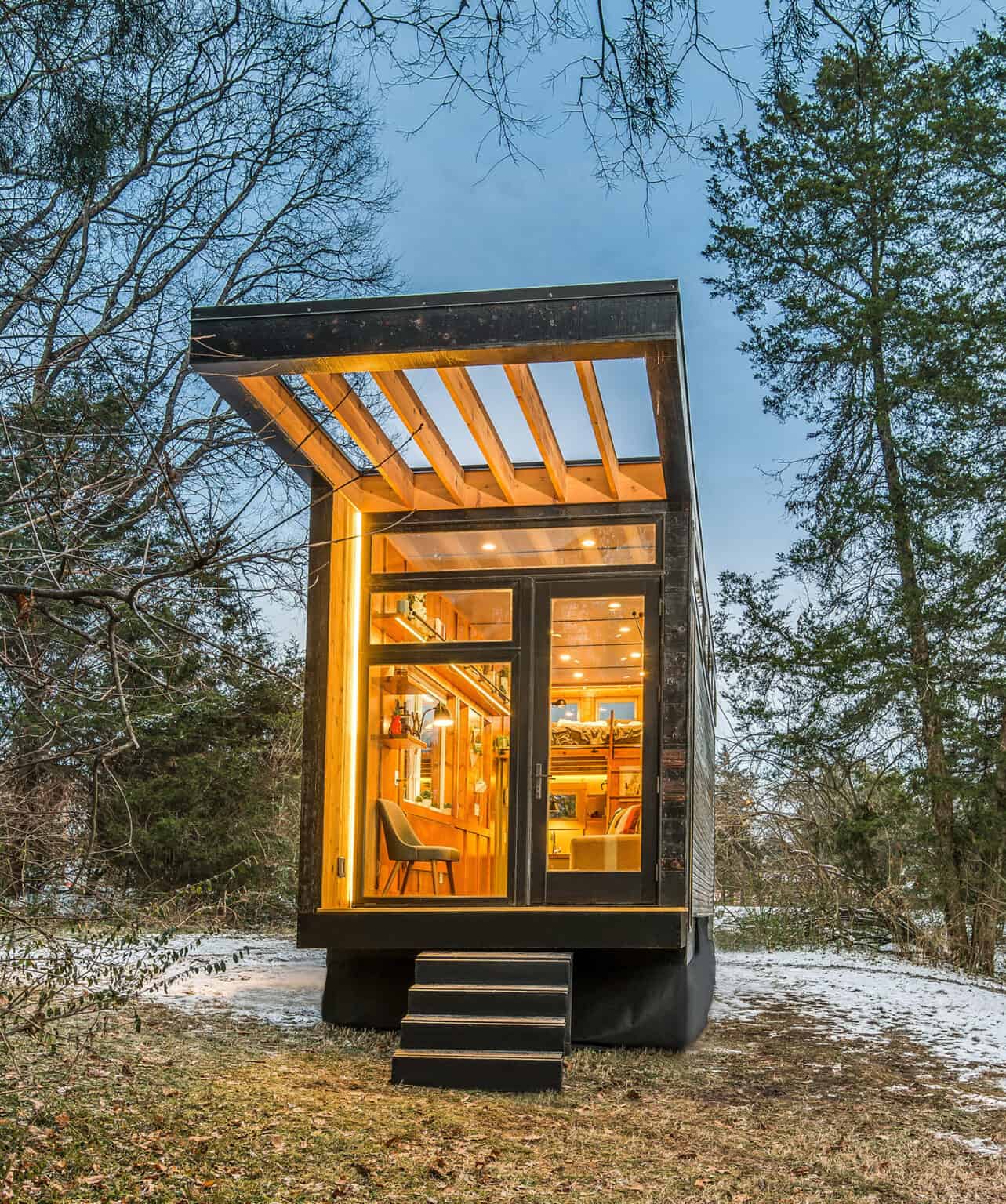A cozy writer's cabin provides a dreamy retreat in the woods