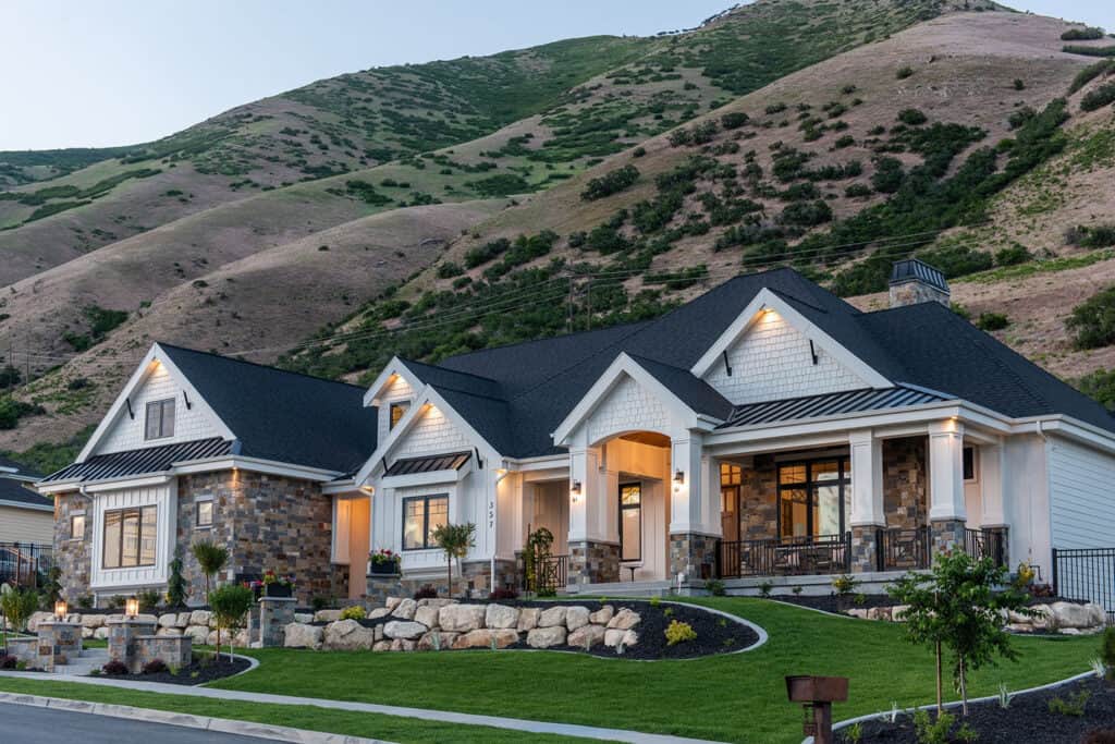 Farmhouse style dream house in Utah with a mountainous backdrop