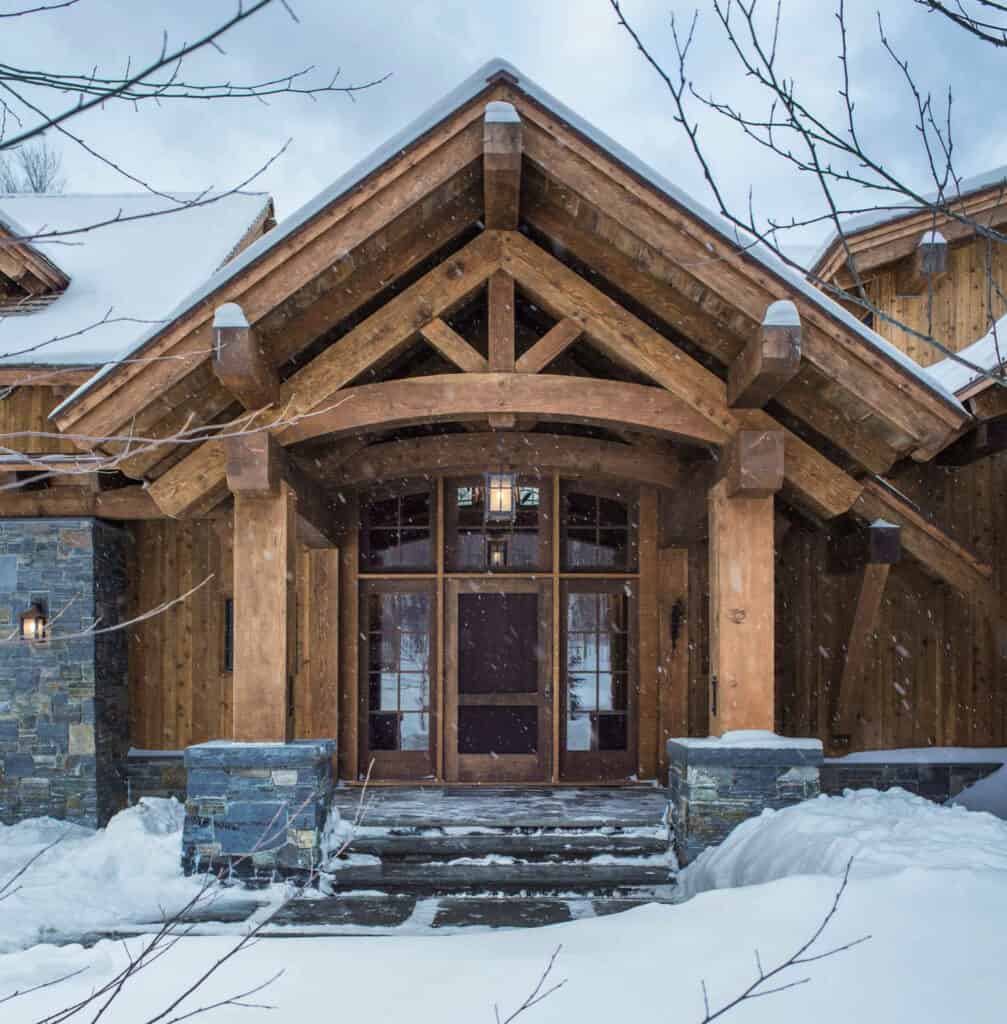 Handcrafted family home in Vermont with a backdrop of snowy peaks