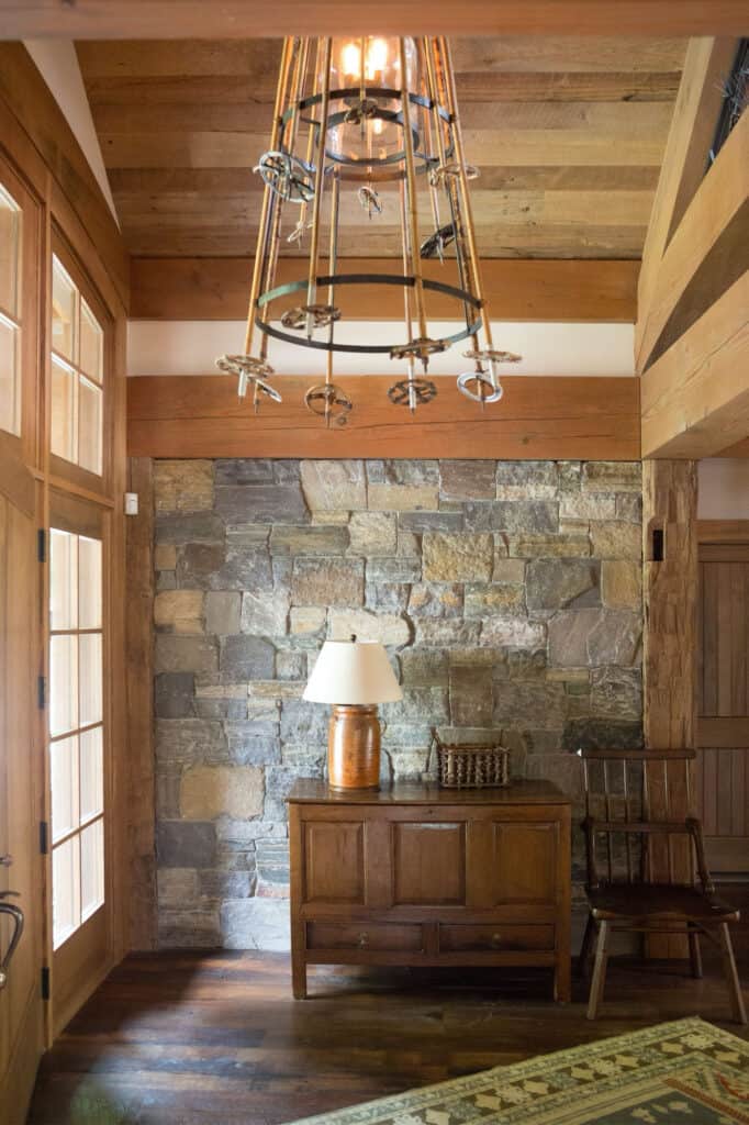 Handcrafted family home in Vermont with a backdrop of snowy peaks