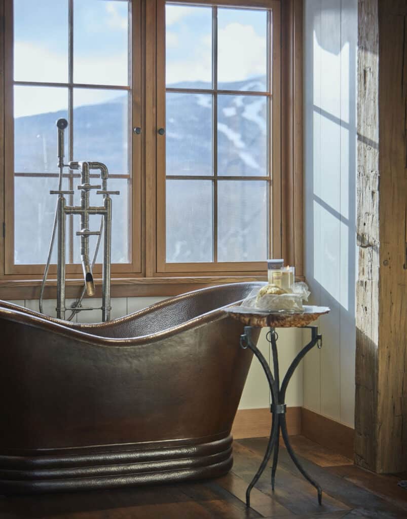 Handcrafted family home in Vermont with a backdrop of snowy peaks