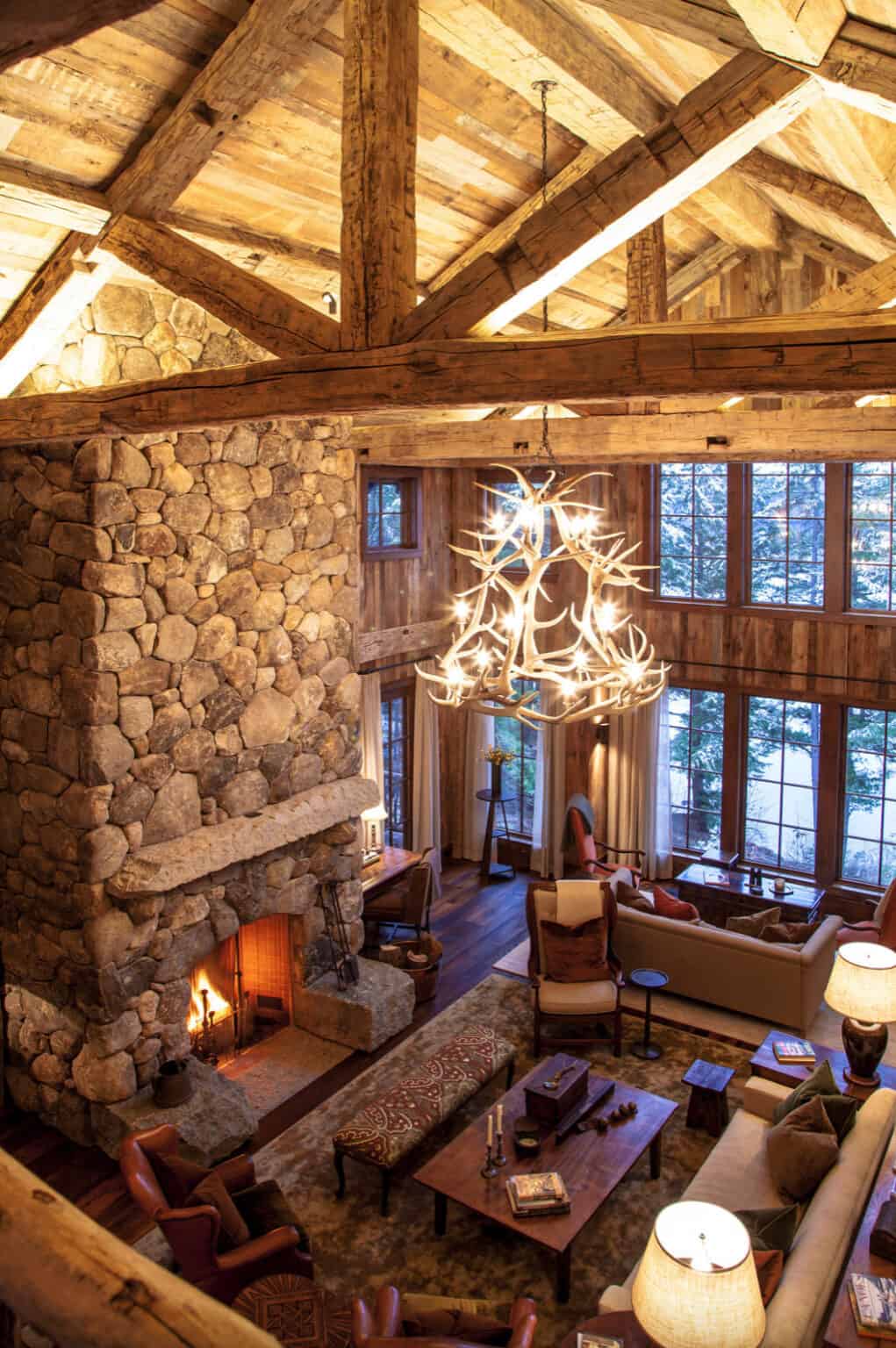 A beautiful Adirondack lodge in New Hampshire with a snowy backdrop
