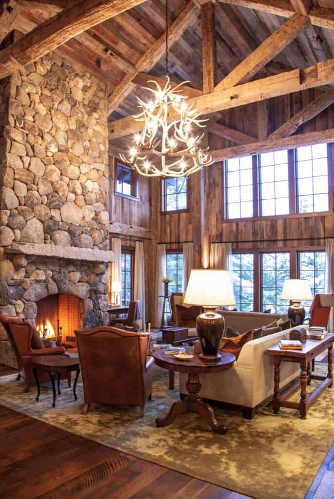 A beautiful Adirondack lodge in New Hampshire with a snowy backdrop