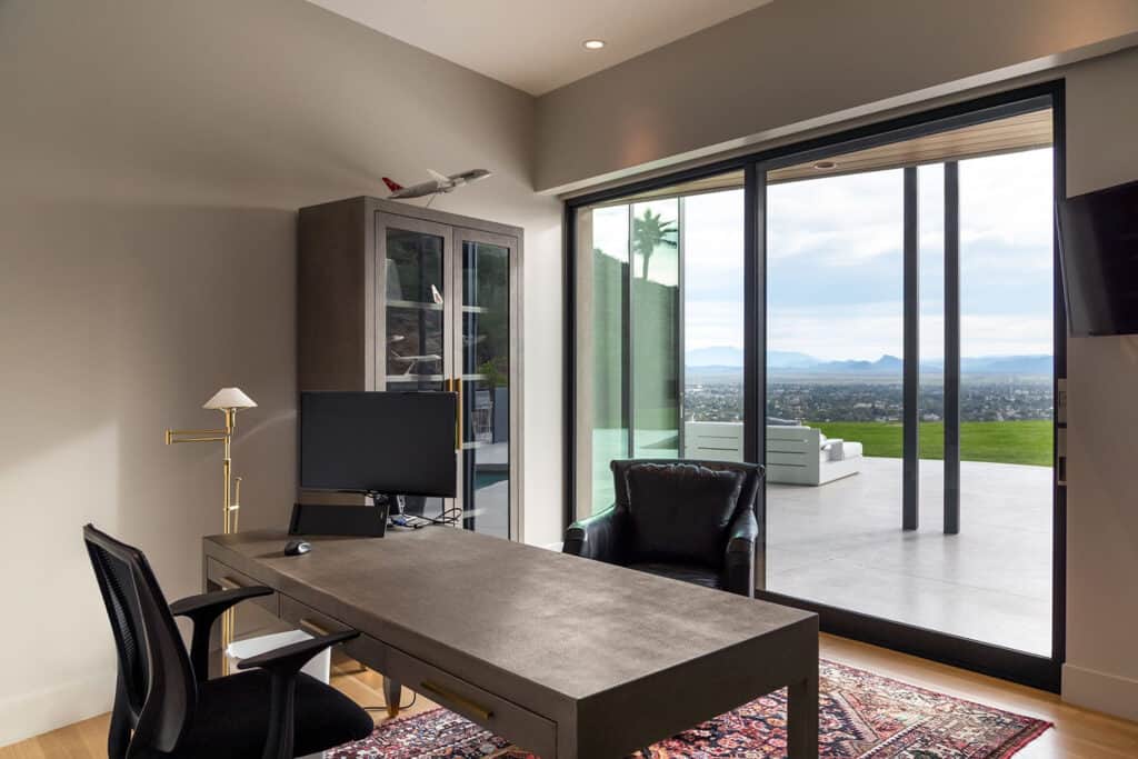 This impressive modern house opens to the Arizona desert landscape