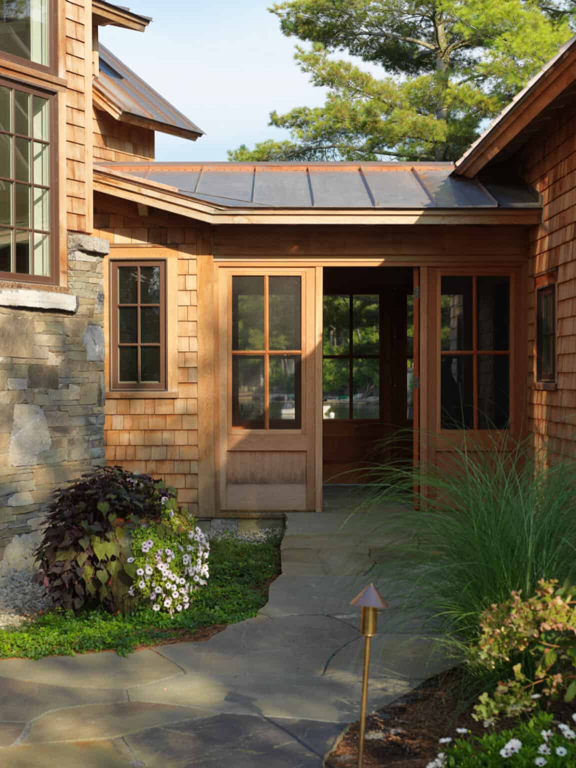 A camp style home nestled on the breathtaking Lake Champlain