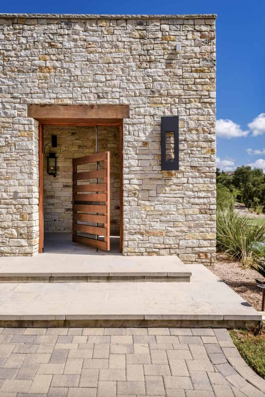 Step into this inviting Texas Hill Country house with luminous interiors