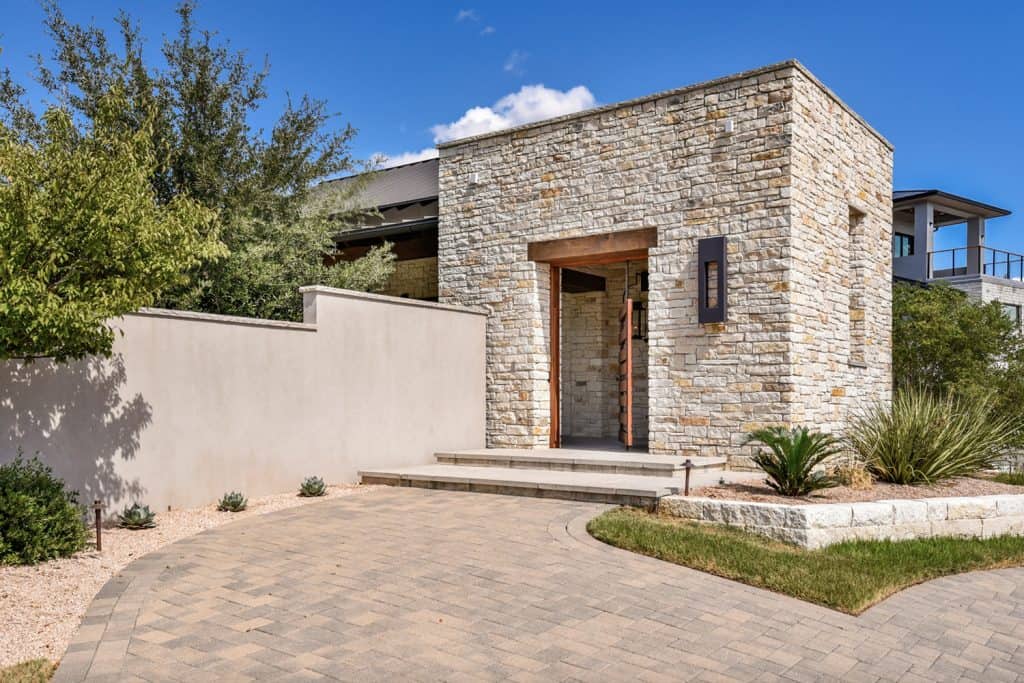Step into this inviting Texas Hill Country house with luminous interiors