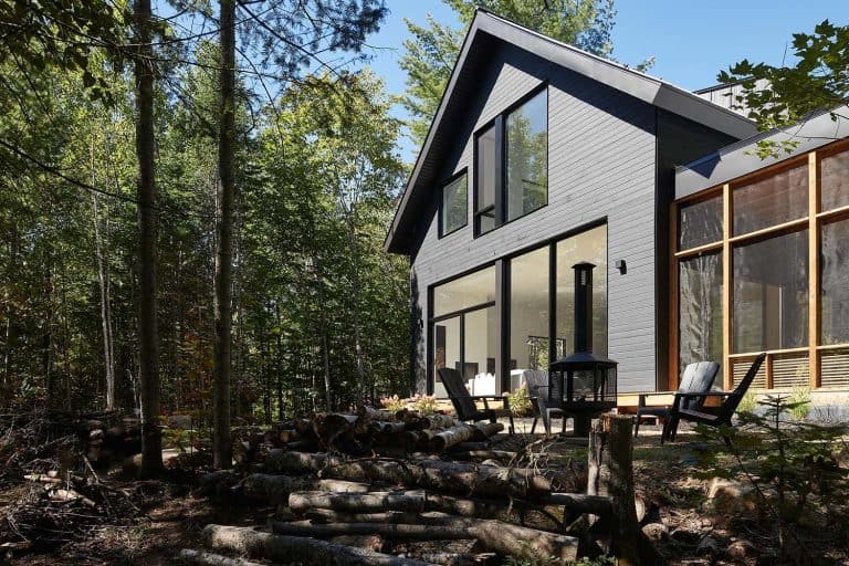 Black charred cedar creates a bold look for this Quebec lake house
