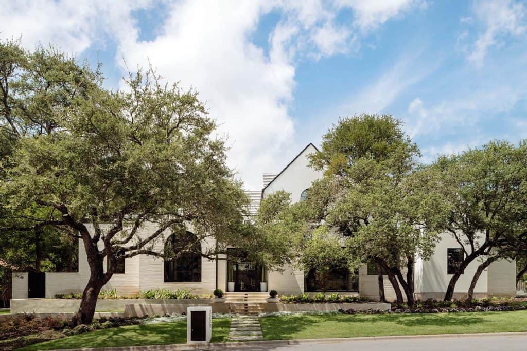 Step into this beautiful Austin home hidden amongst majestic live oaks