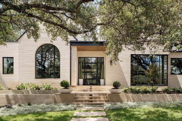 Step into this beautiful Austin home hidden amongst majestic live oaks
