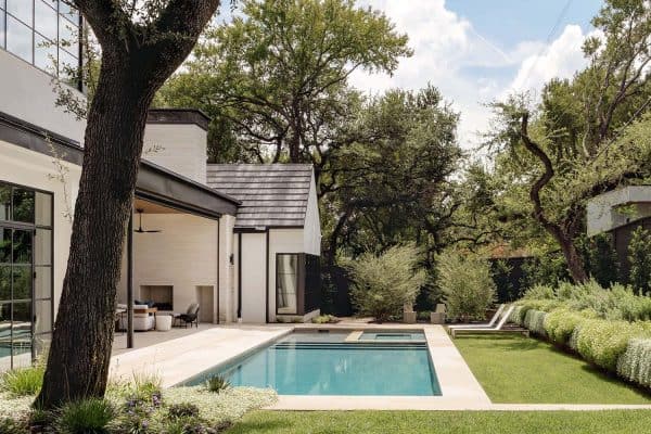 Step into this beautiful Austin home hidden amongst majestic live oaks
