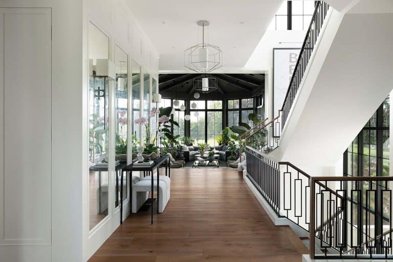 A striking greenhouse inspired lake house offers a sanctuary in Minnesota