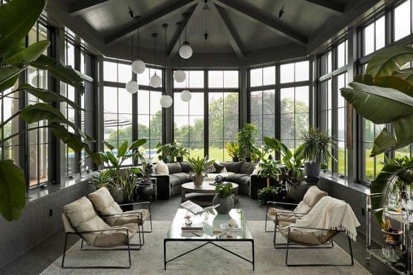 A striking greenhouse inspired lake house offers a sanctuary in Minnesota