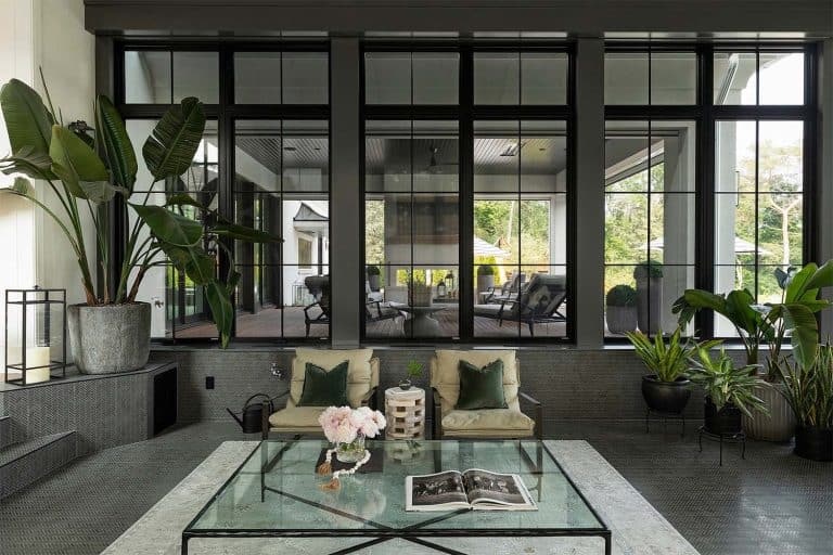 A striking greenhouse inspired lake house offers a sanctuary in Minnesota