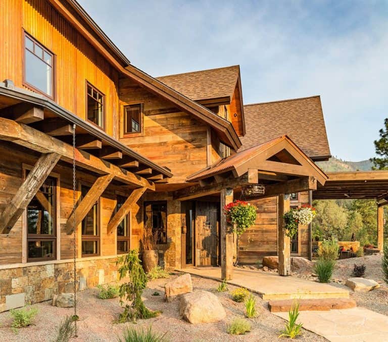 Reclaimed barn wood and stone house with picturesque Rocky Mountain views