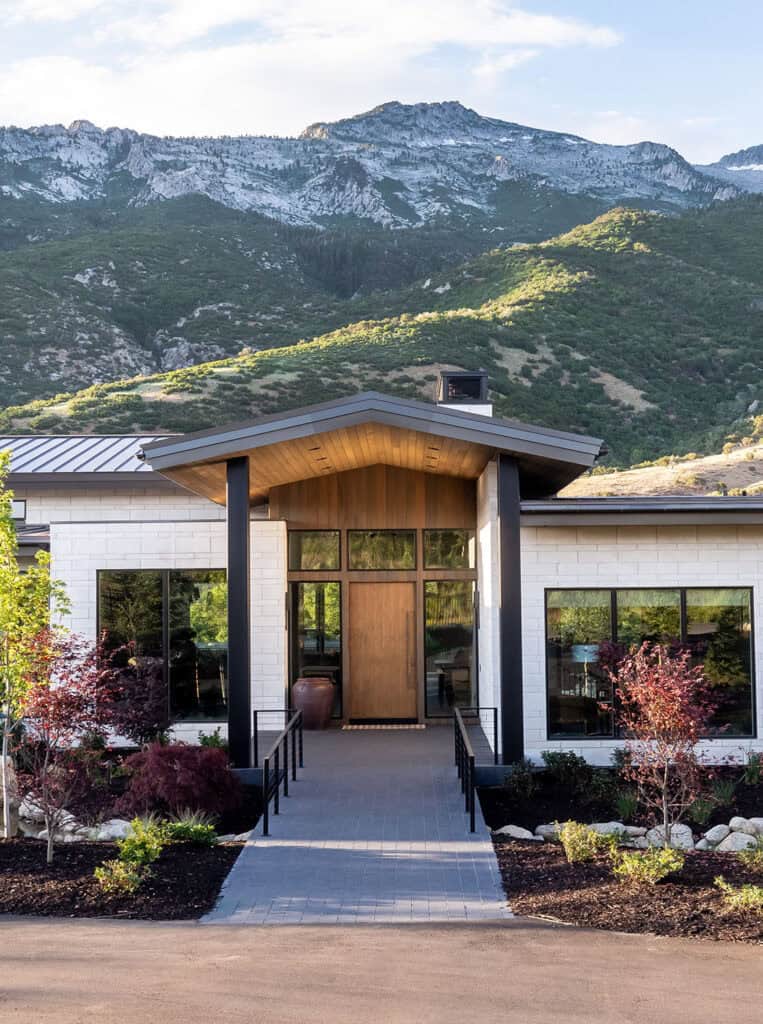 A gorgeous mountainside house with a dramatic backdrop of the Utah ...