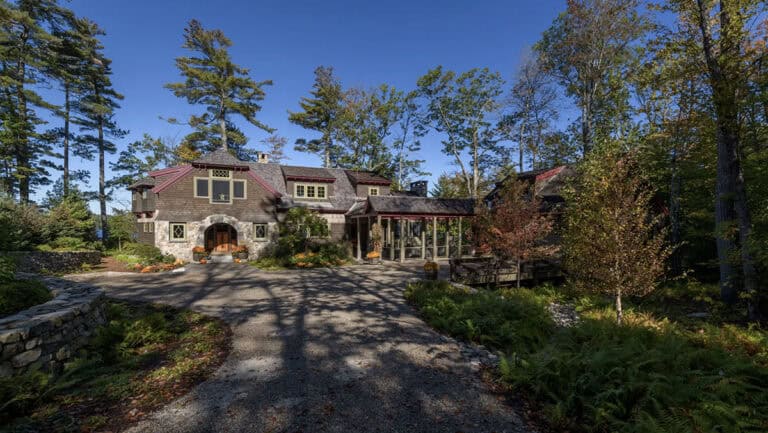 Tour this charming lakeside cottage on a picturesque New Hampshire lake