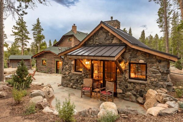 Historic Colorado log cabin gets a charming update in the towering pines