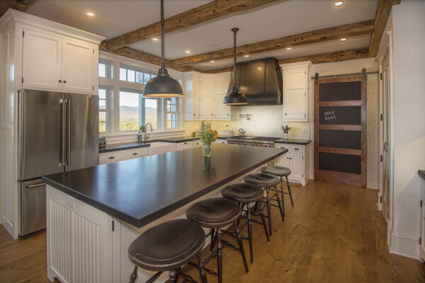 Step inside this Vermont modern farmhouse with idyllic mountain views