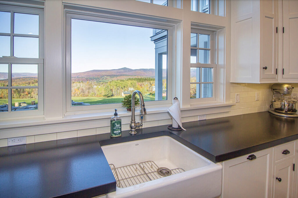 Step inside this Vermont modern farmhouse with idyllic mountain views