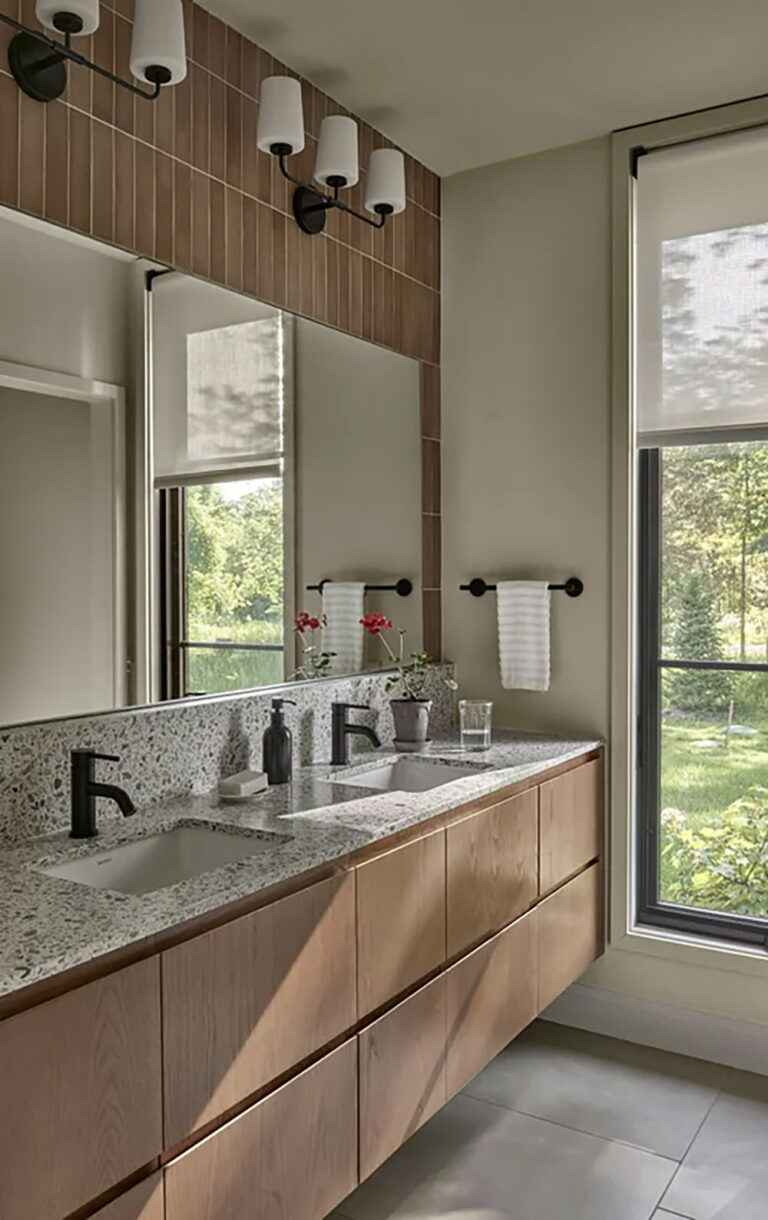 The prairie house offers a serene rural retreat in the forests of Michigan