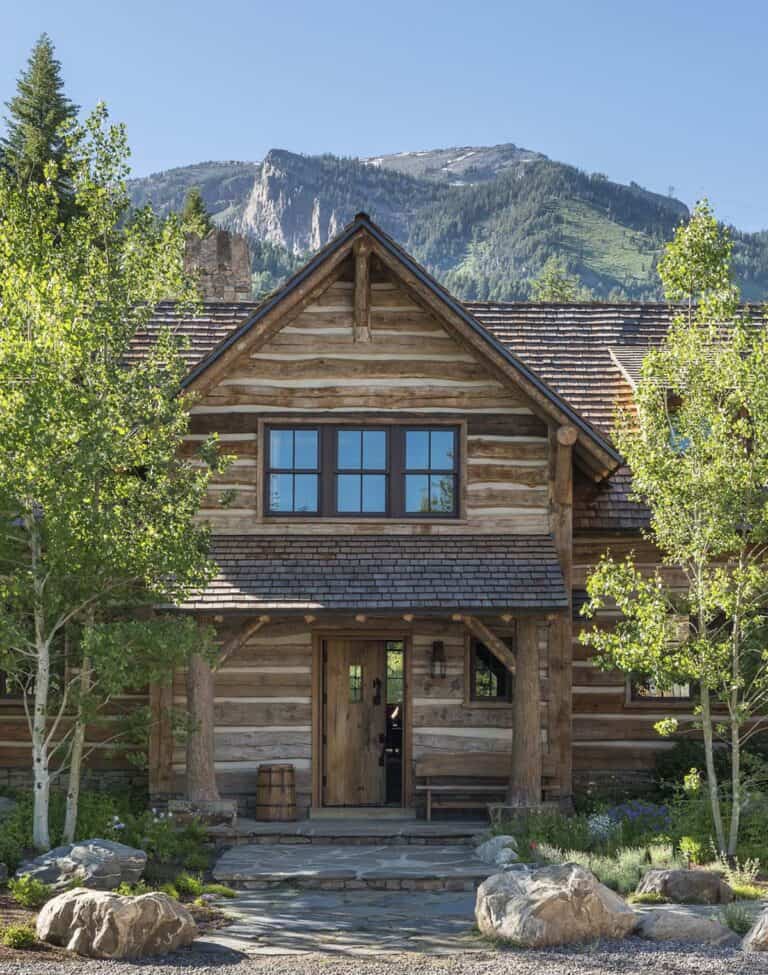 Inside a rustic Wyoming mountain house with a dramatic backdrop of the ...