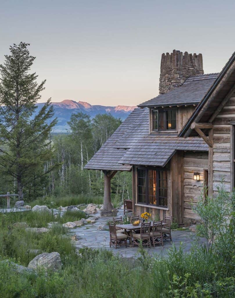 Inside a rustic Wyoming mountain house with a dramatic backdrop of the ...