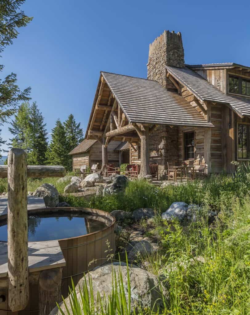 Inside a rustic Wyoming mountain house with a dramatic backdrop of the ...
