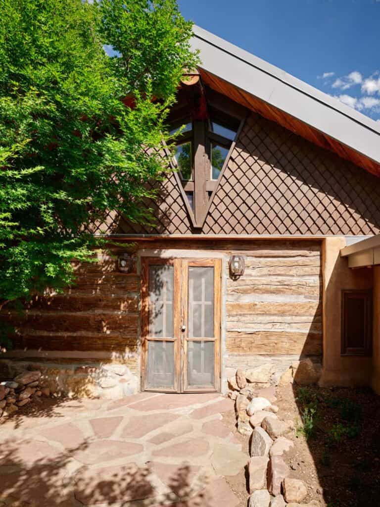 Historic log cabin barns get transformed into a charming Santa Fe home